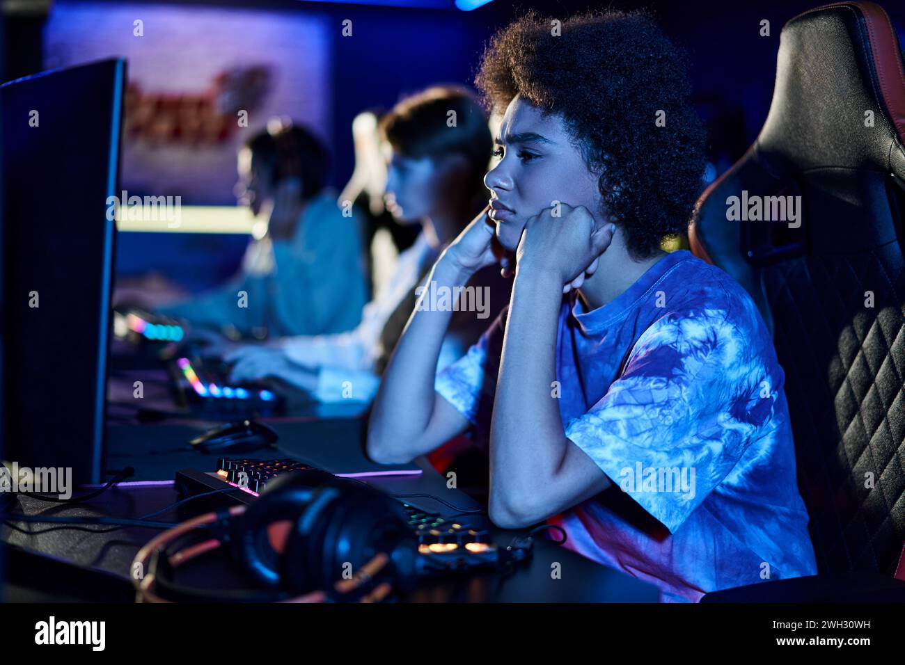 sad african american woman looking at computer monitor and puffing ...