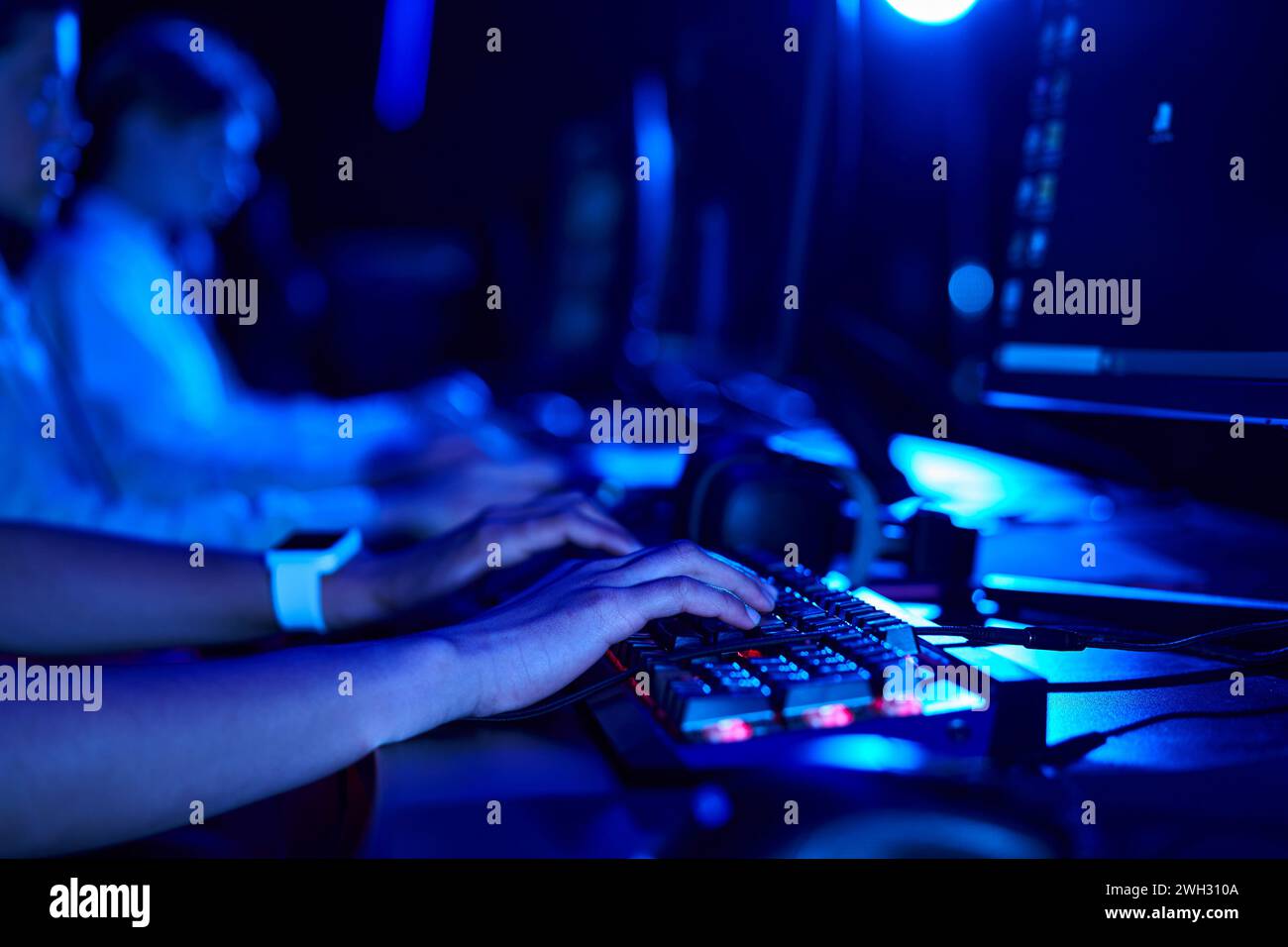 cropped photo of female hands, young gamer using computer keyboard ...