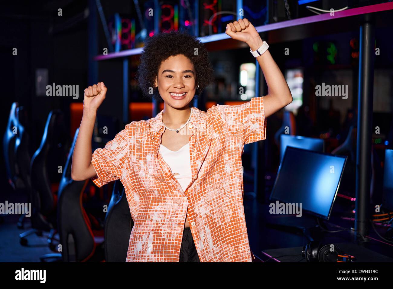 african american woman in vibrant clothing, her face radiating with joy ...