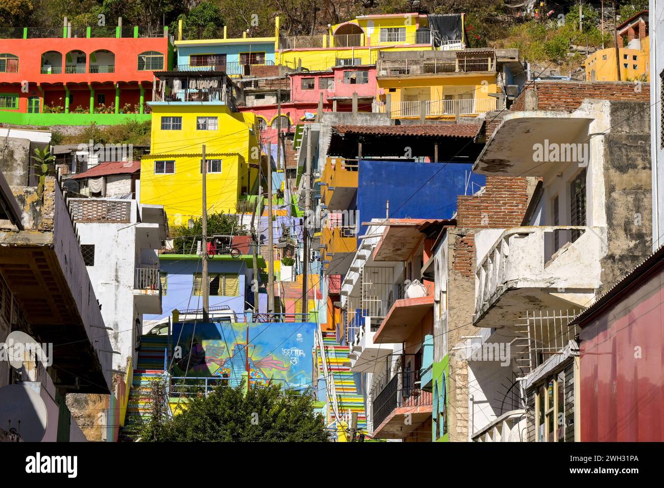Manzanillo, Mexico - 16 January 2024: Multi coloured houses and steps ...