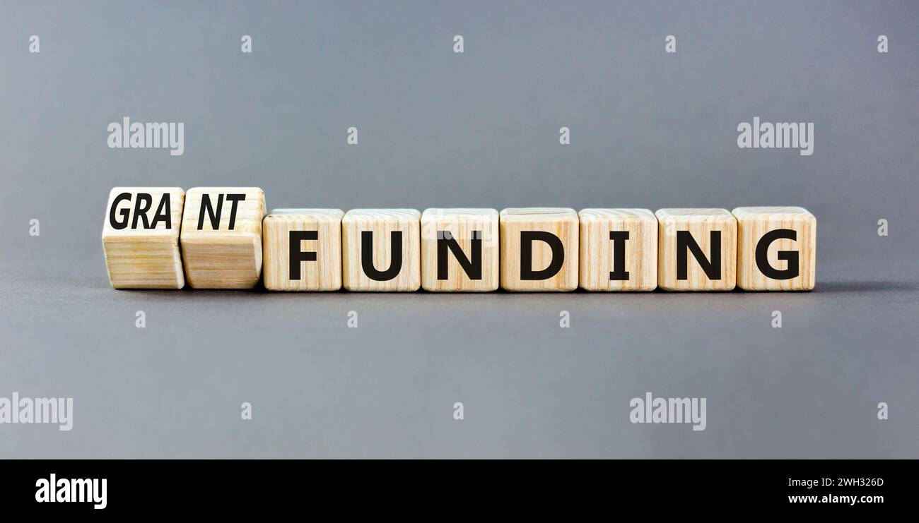 Grant funding symbol. Concept words Grant funding on beautiful wooden ...