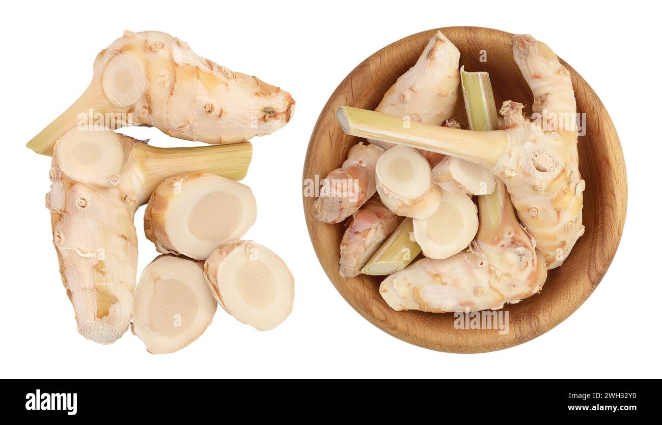 Fresh galangal root in wooden bowl isolated on white background with ...