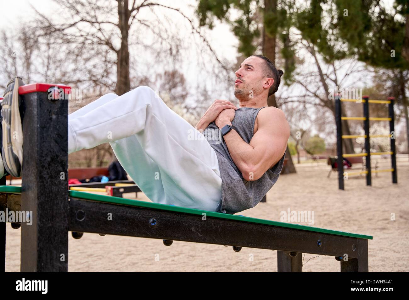 Young man doing sit ups hi-res stock photography and images - Alamy