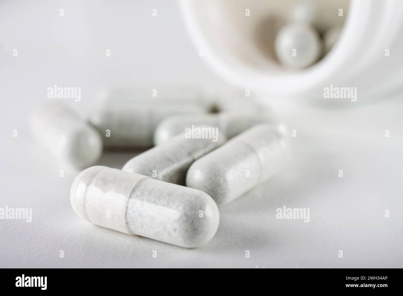 Nutritional supplement, herb capsule on white background Stock Photo ...