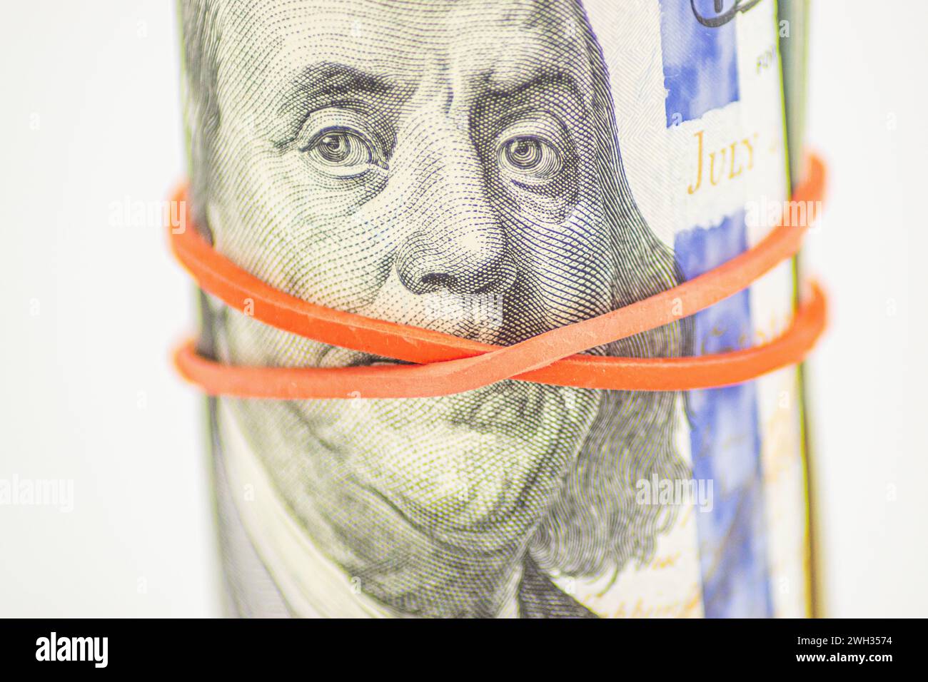 Concept of silent money. Red tape covers Franklin's mouth on the 100 ...