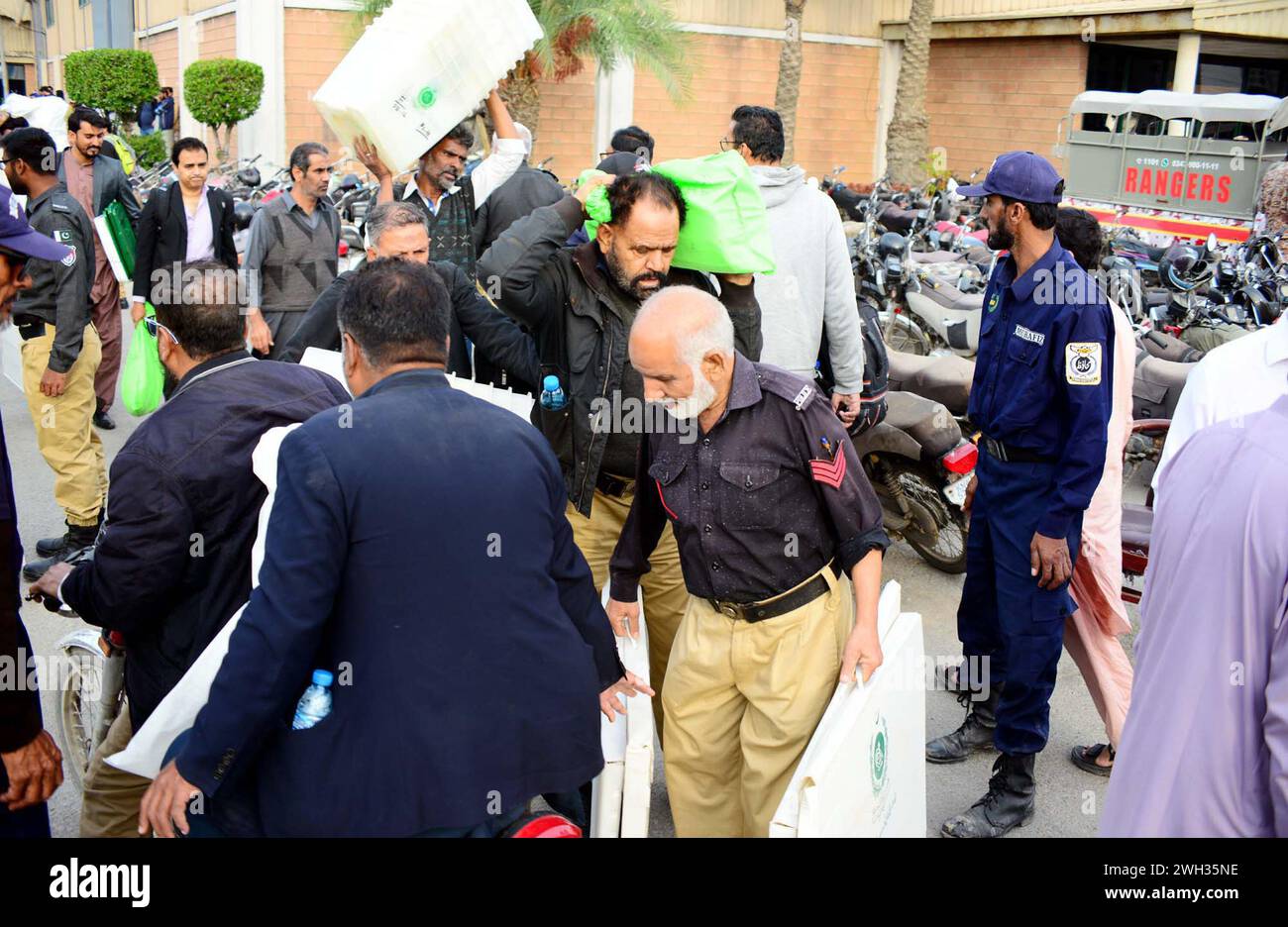 Polling staffs gather for collecting ballot boxes and election ...