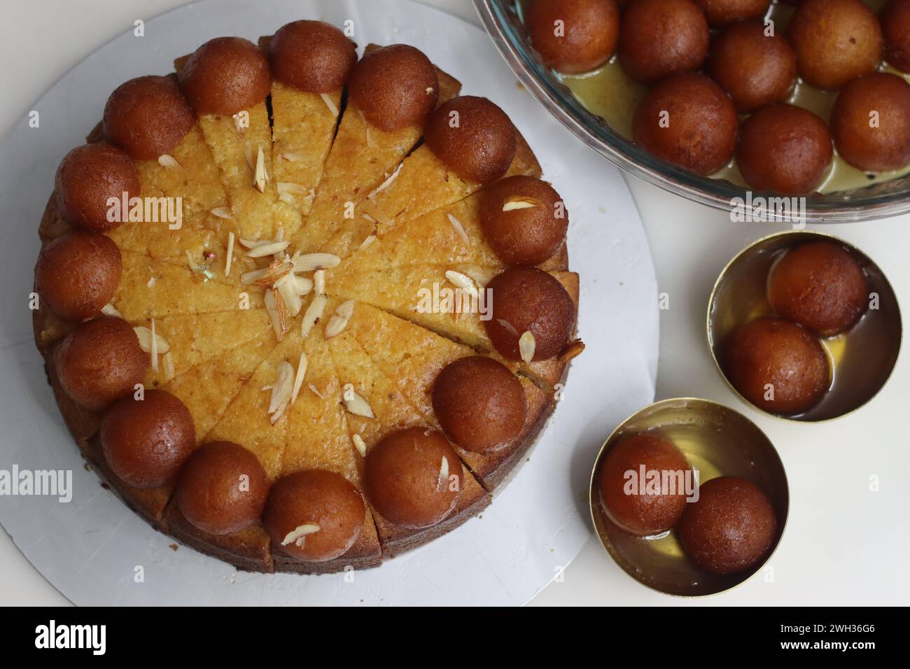 Gulab Jamun Cake decorated with gulab jamun on top. Irresistible fusion ...