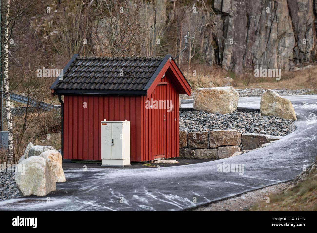 Small red wooden utilities building Stock Photo - Alamy