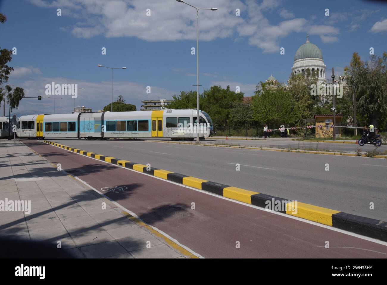 Hellenic railways Stadler GTW train at a level crossing in Patras ...