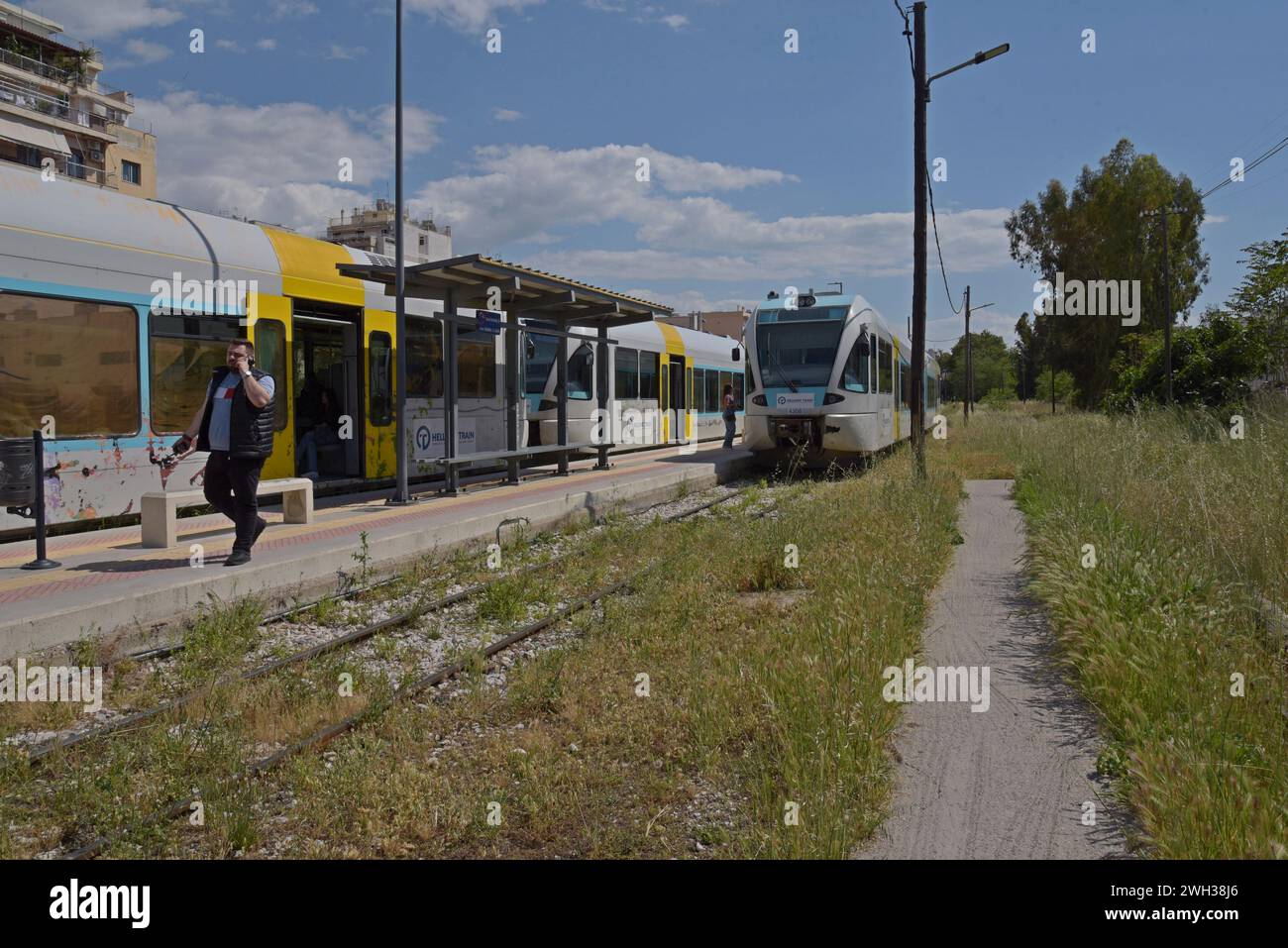 Passengers changing trains at the Hellenic Trains Agios Andreas railway ...