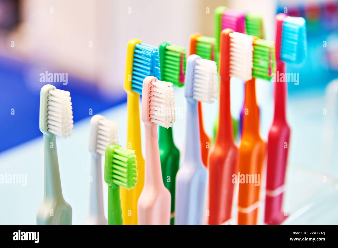 Colored toothbrushes on display in a store Stock Photo - Alamy