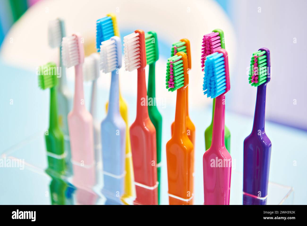 Colored toothbrushes on display in a store Stock Photo - Alamy