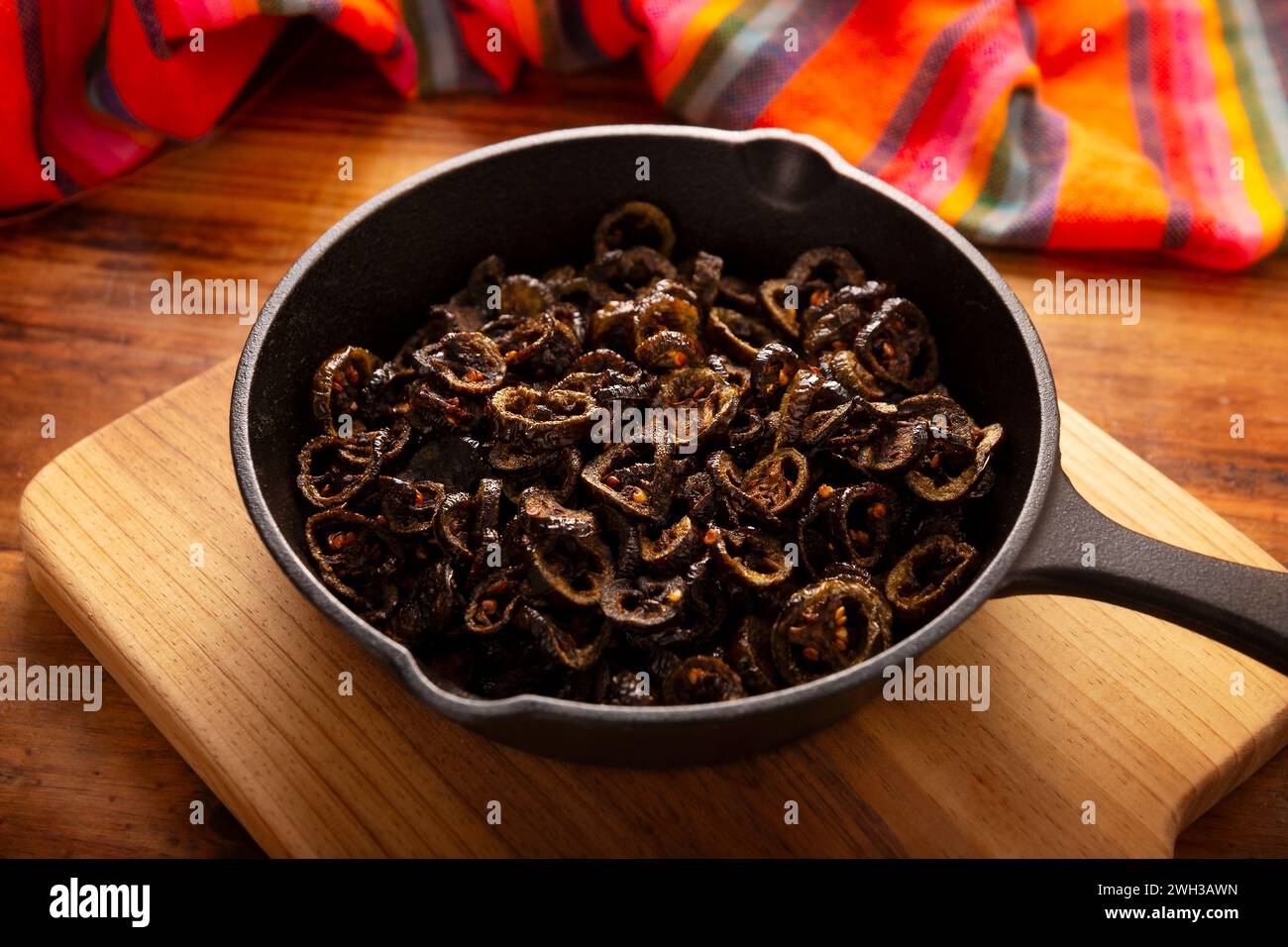 Chili chips in cast iron skillet. In Mexico called Chicharron de Chile ...