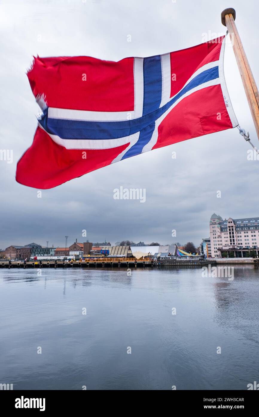 The Norwegian flag flying from the flag pole of a schooner sail boat ...
