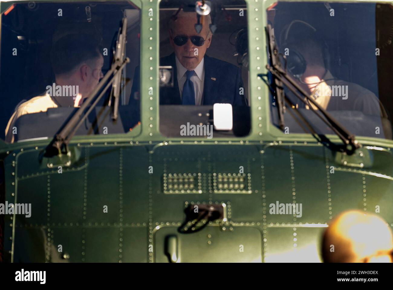 President Joe Biden speaks to pilots aboard Marine One as he arrives at ...
