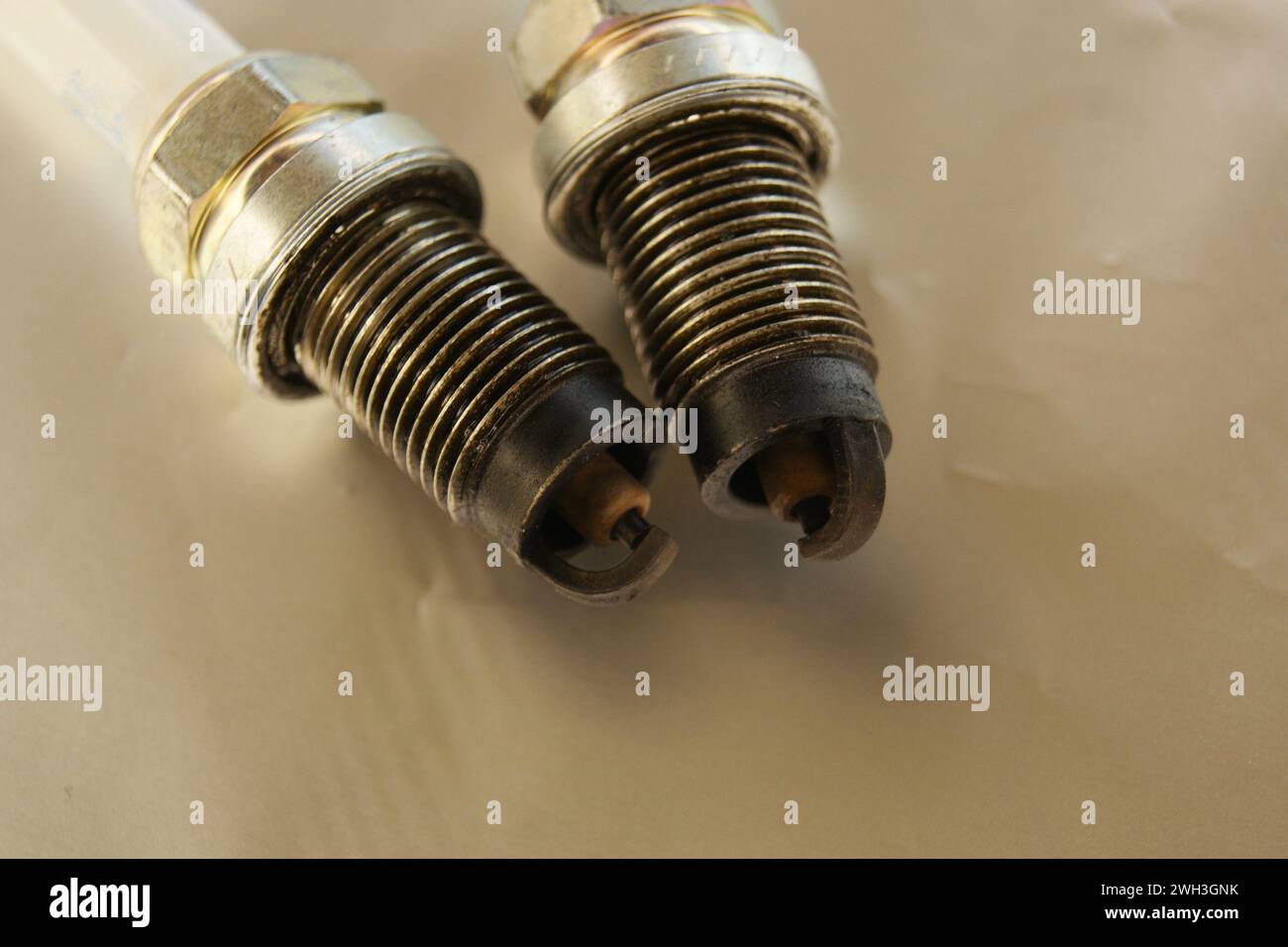 Used gasoline engine spark plugs Stock Photo - Alamy