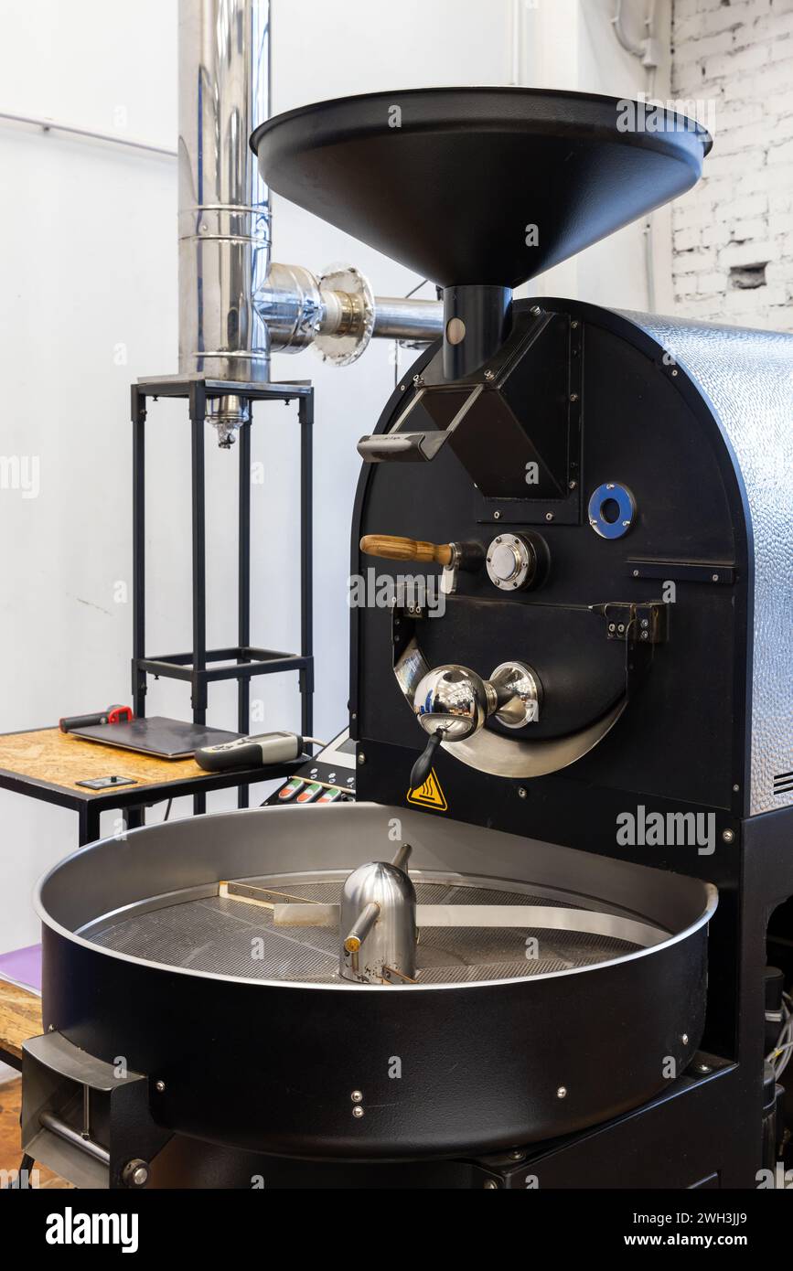 Industrial coffee roaster close-up vertical photo Stock Photo - Alamy