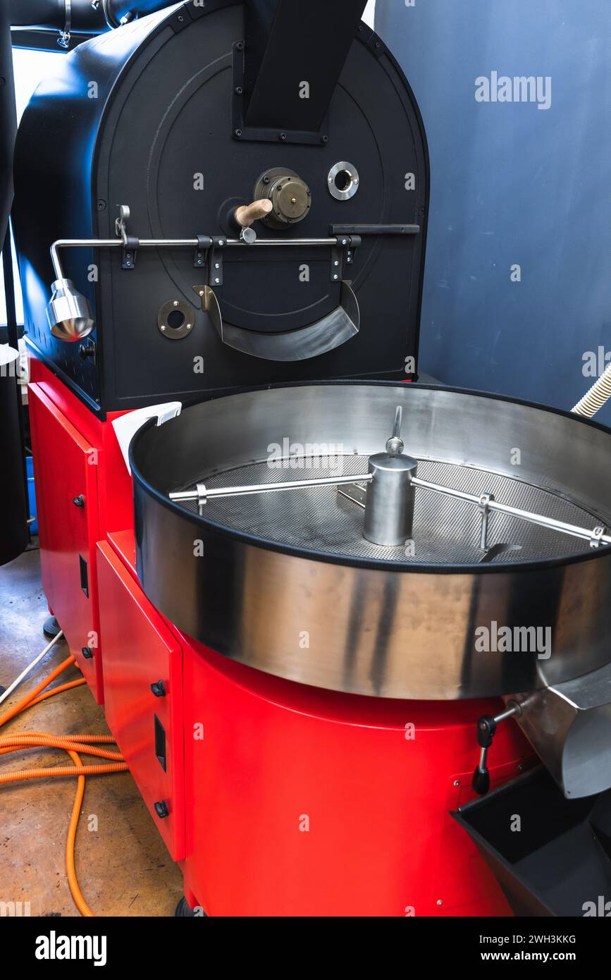 Coffee roaster in a coffeehouse, vertical photo of industrial roastery ...