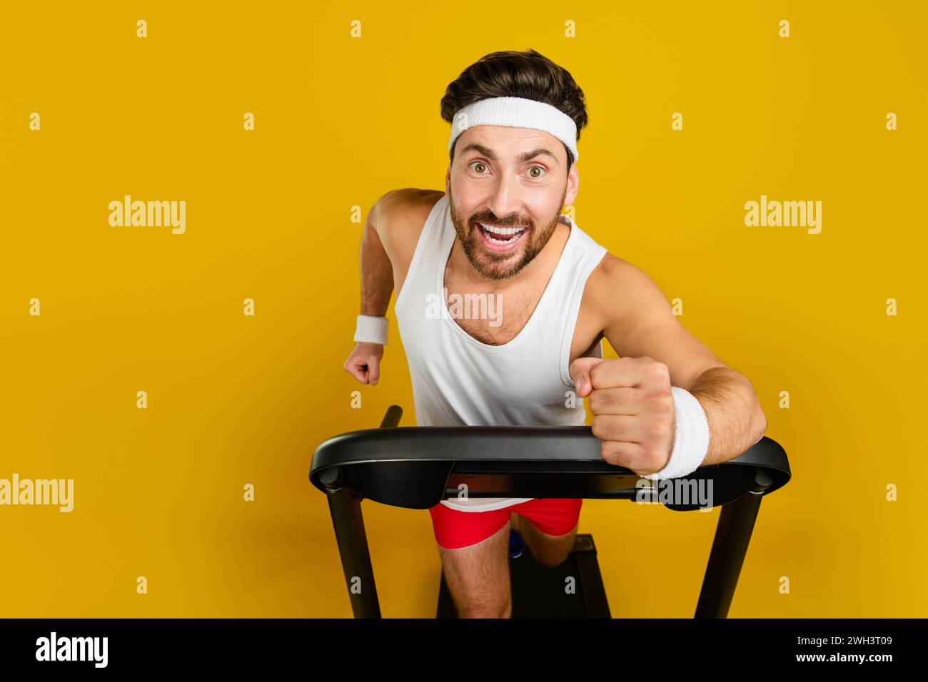 Photo of impressed funky guy sportswear running fast treadmill empty ...