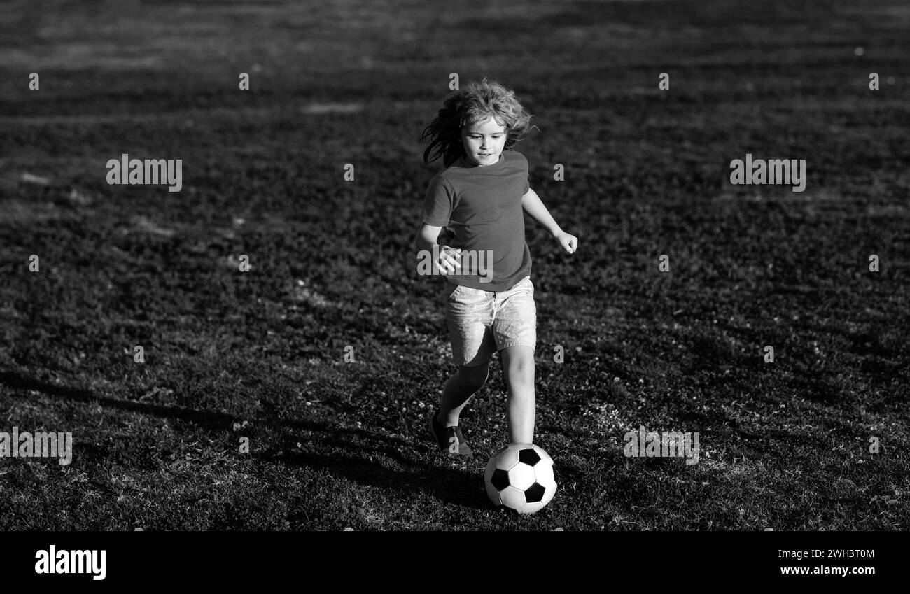 Soccer kid boy playing football. Child boy play football on outdoor ...