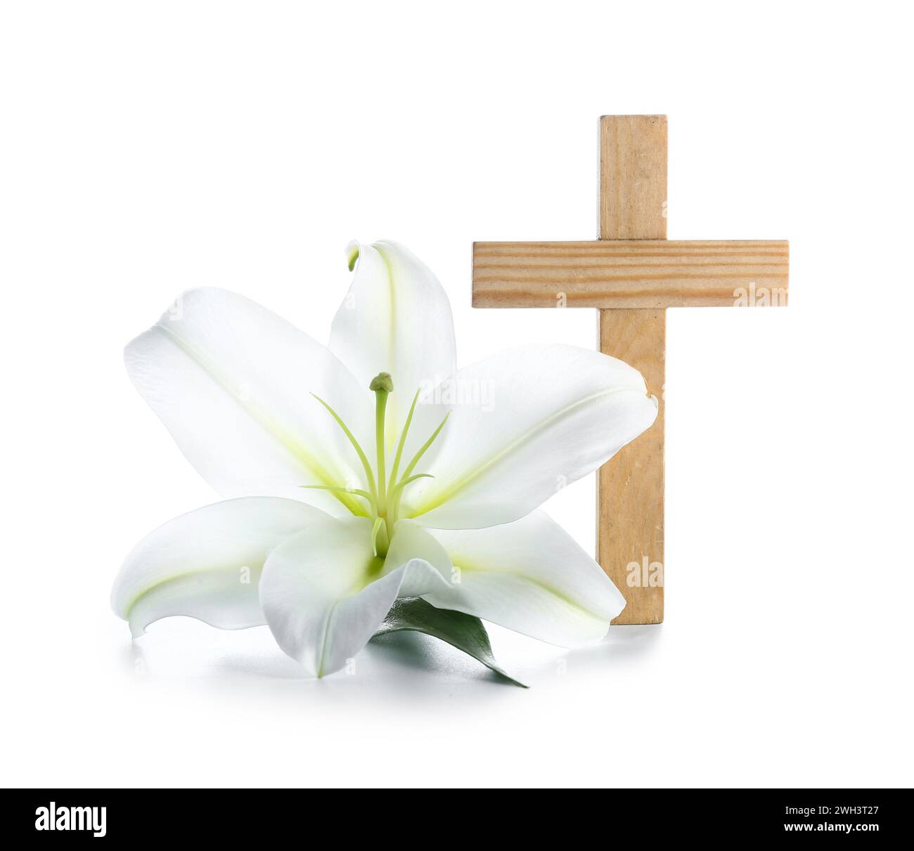 Lily flower and wooden cross on white background Stock Photo - Alamy
