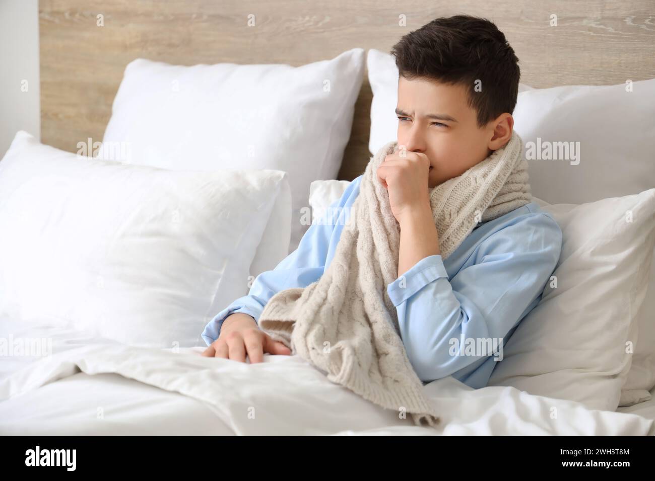 Sick boy in bed coughing hi-res stock photography and images - Alamy