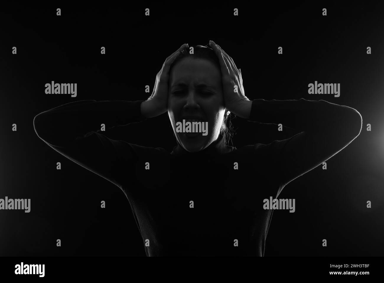 Silhouette of young woman shouting on black background Stock Photo - Alamy