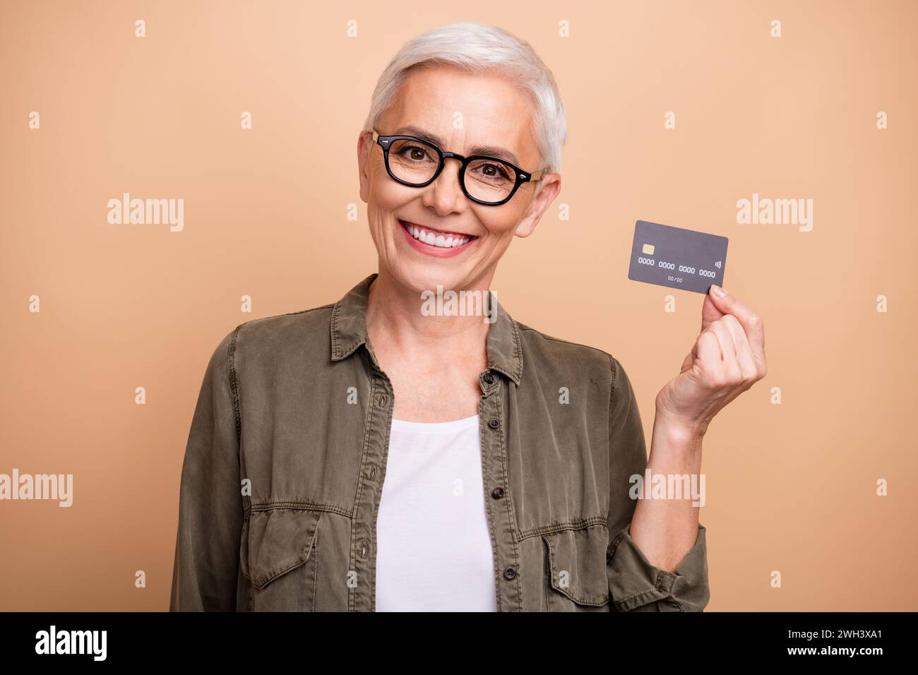 Portrait of middle age woman demonstrate her vip client credit card ...