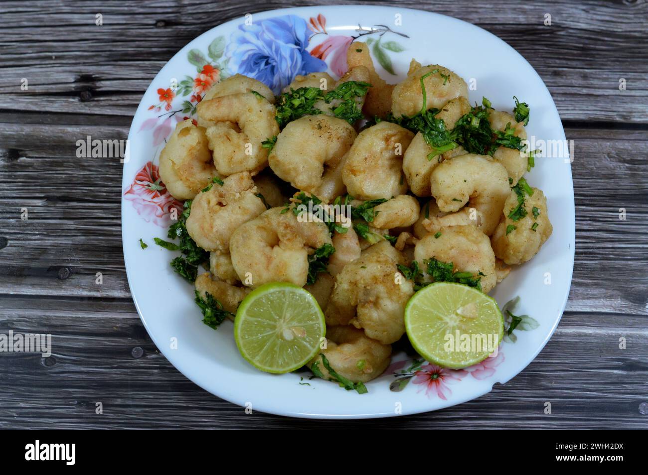 Fried shrimps covered with flour and fried in deep hot oil, shrimps are ...