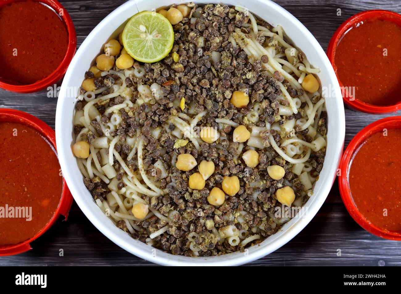 Egyptian cuisine of Koshary, a popular street food made of rice ...