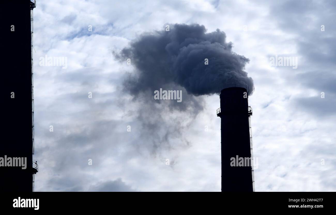 Two chimney of industrial plant contaminated air with toxic smoke ...