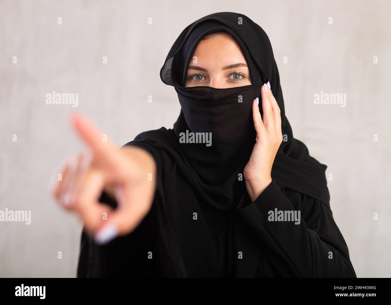 woman with her face covered by burka points her hand to side Stock ...