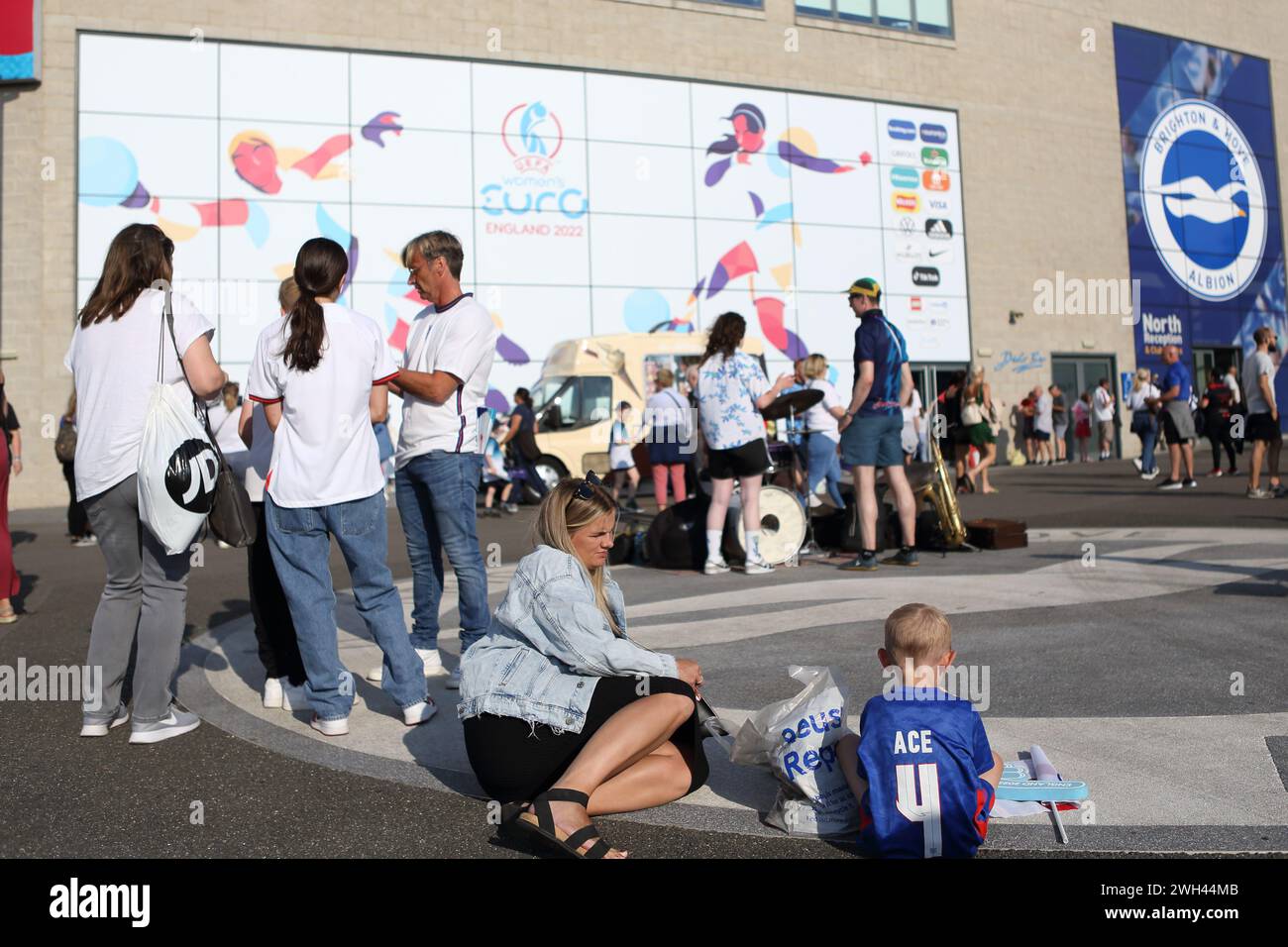 Fans outside stadium in front of tournament branding England v Spain ...