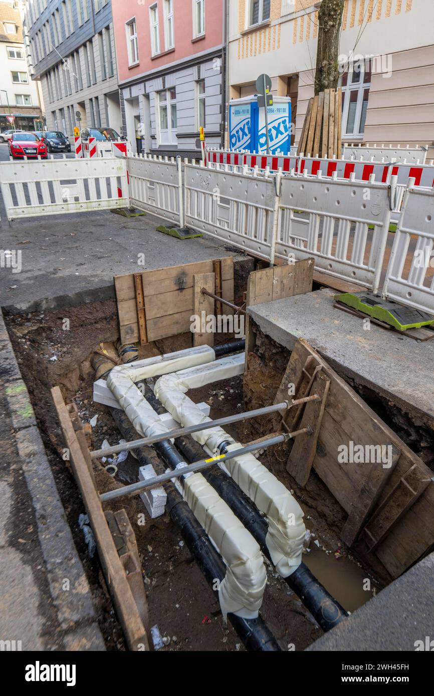 Construction site of a district heating house connection, pipes are ...