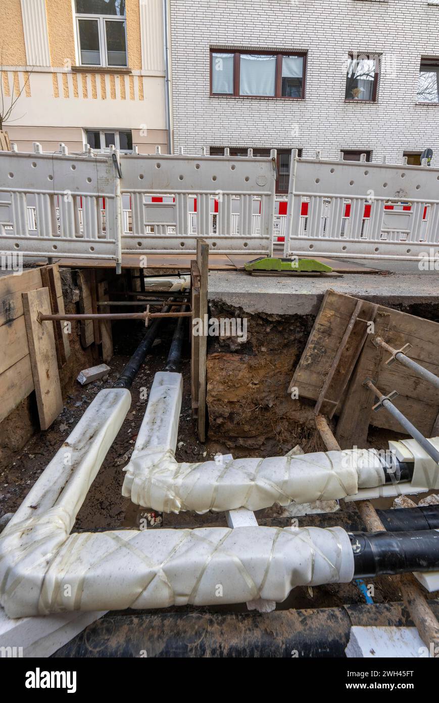 Construction site of a district heating house connection, pipes are laid from a central district ...