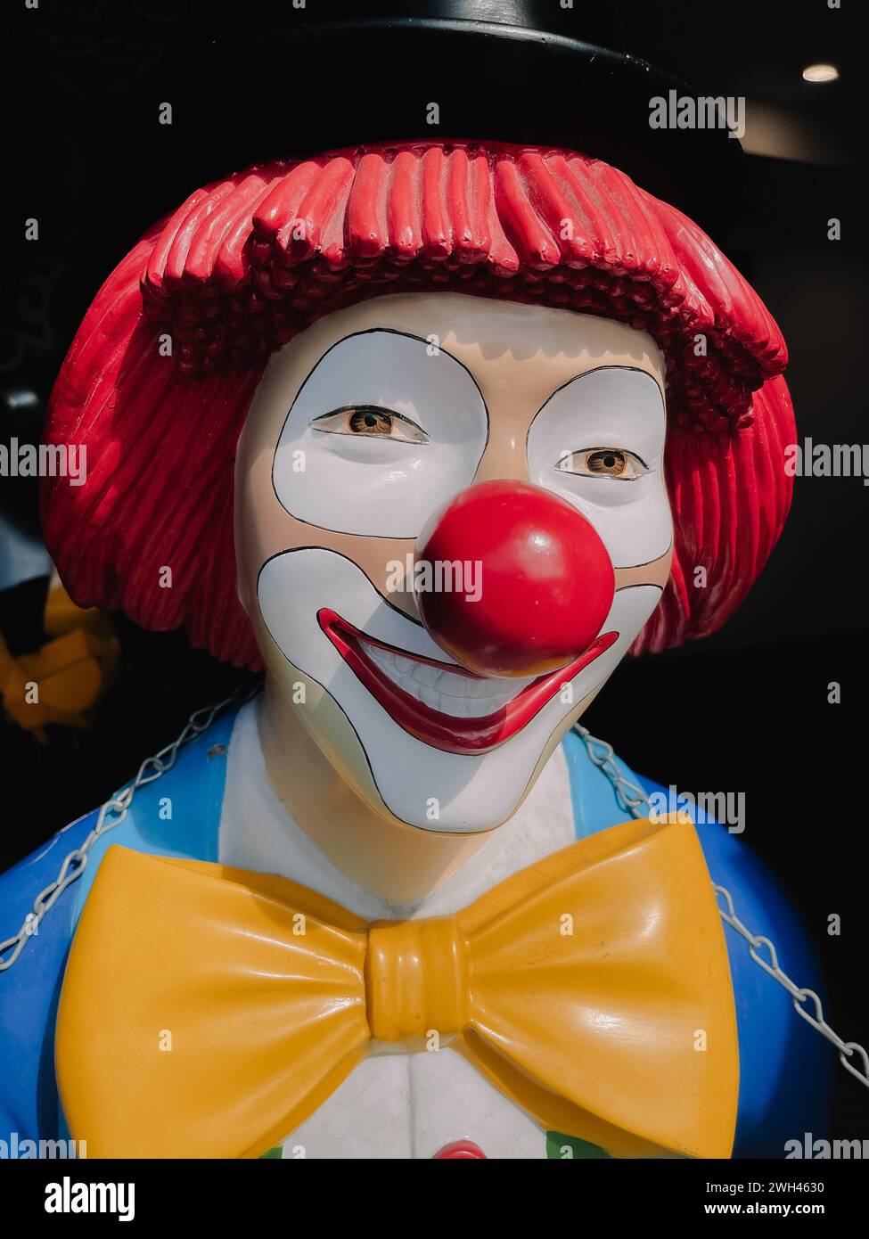 Cute evil happy creepy carnival clown statue Stock Photo - Alamy