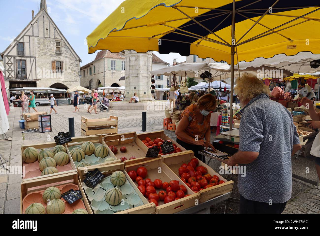 Eymet, the most English of French bastides. Market day on the central ...