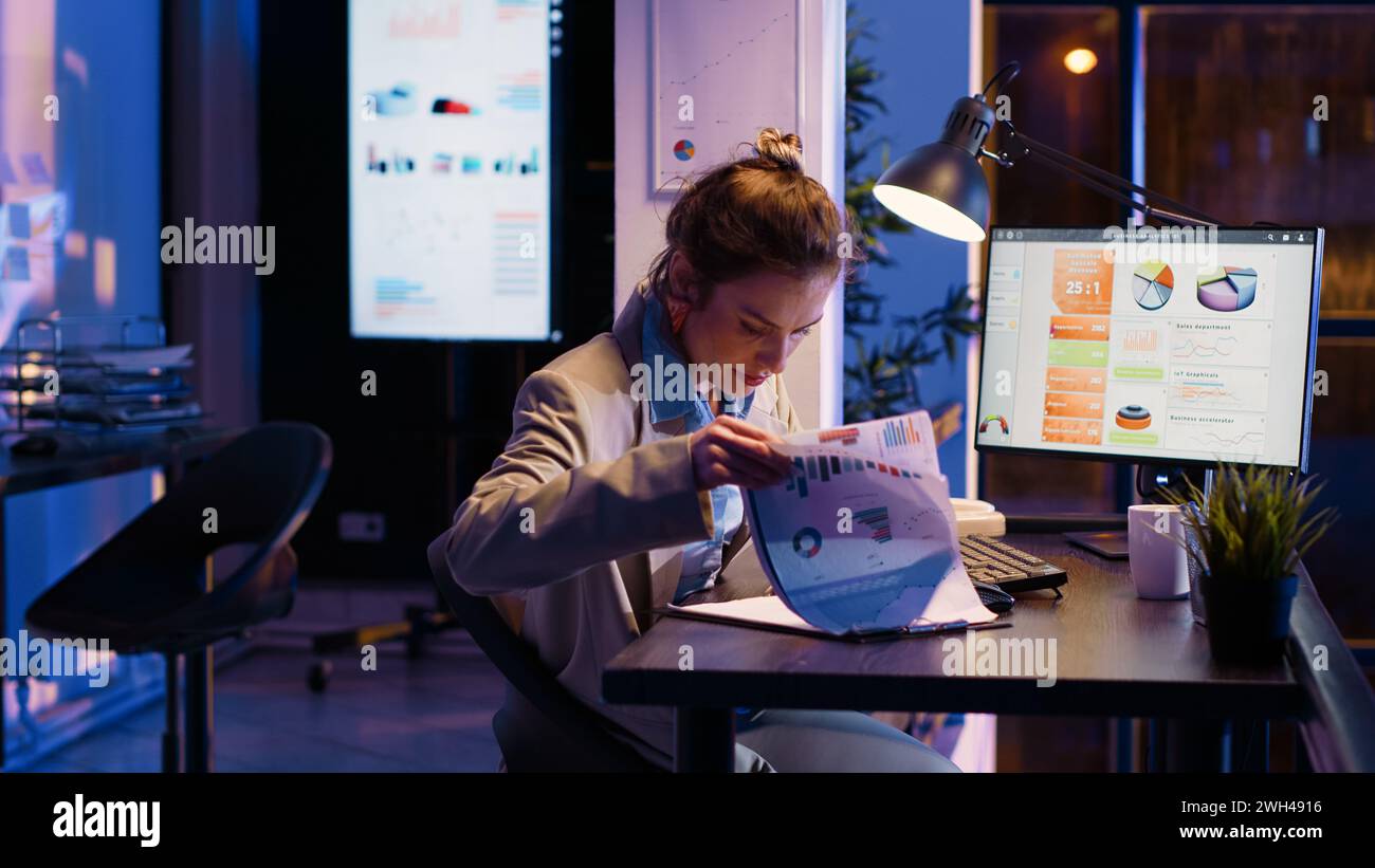 Startup worker analyzing statistics diagrams hi-res stock photography ...