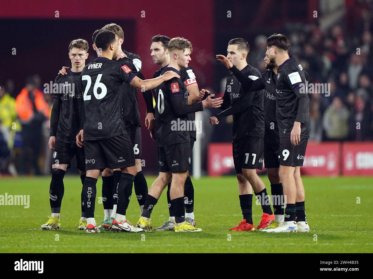 Bristol City's Sam Bell is consoled by team-mates after seeing his ...