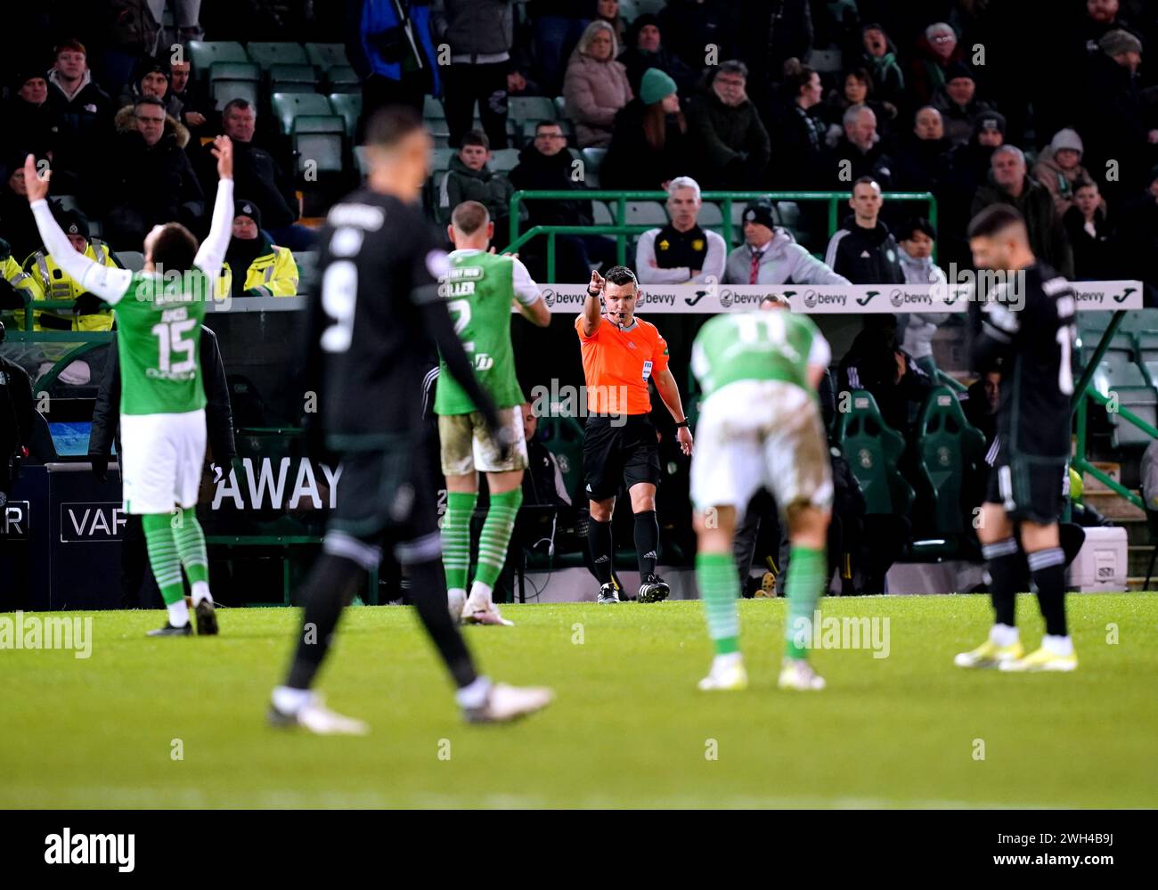 Referee Nick Walsh confirms a penalty is awarded to Celtic following a ...