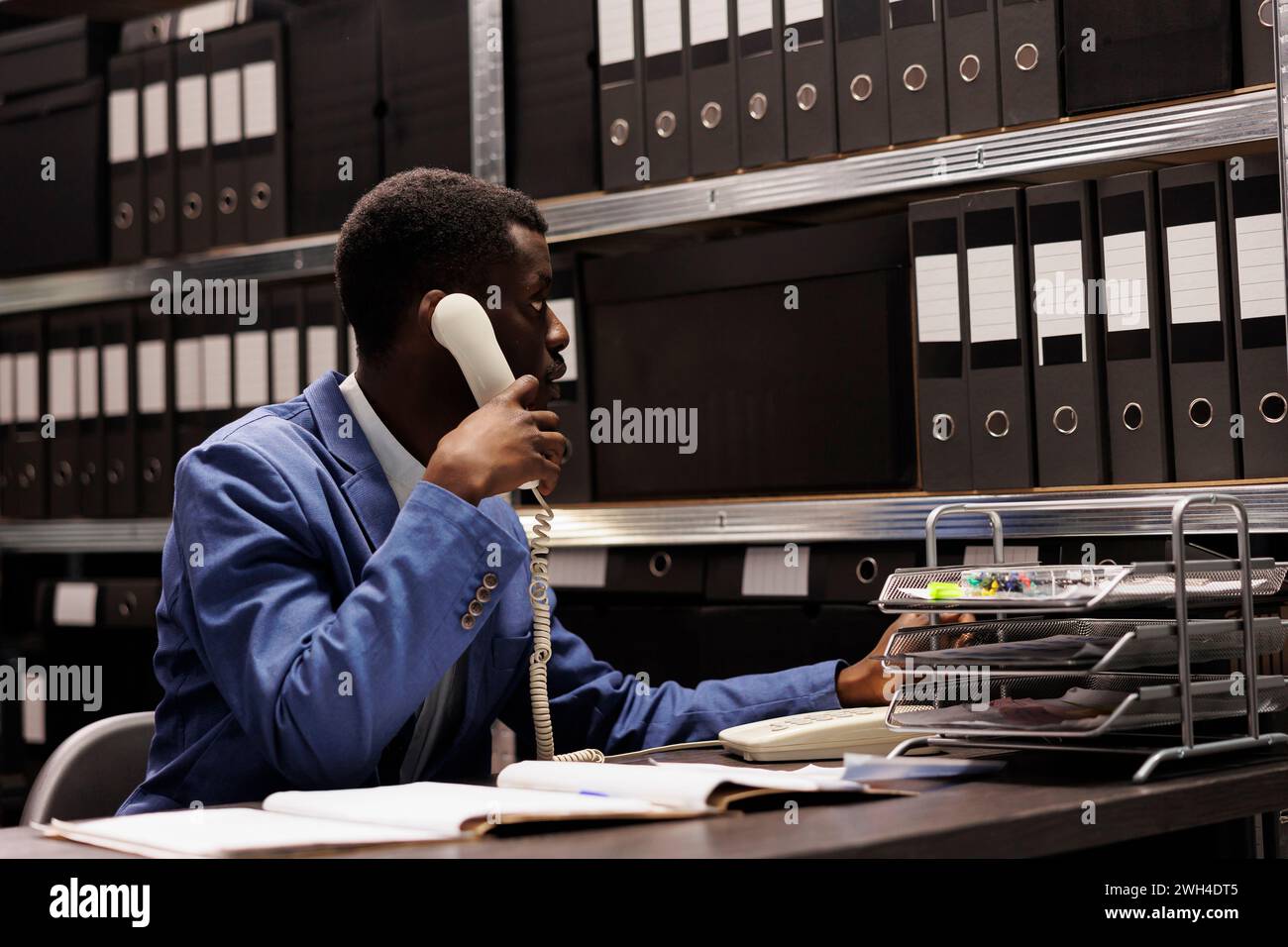 Police officer having remote conversation with inspector, discussing ...