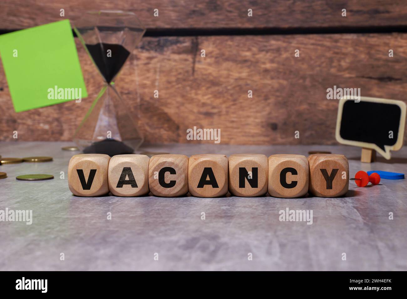 vacancy word is made of wooden blocks lying on the table, concept ...