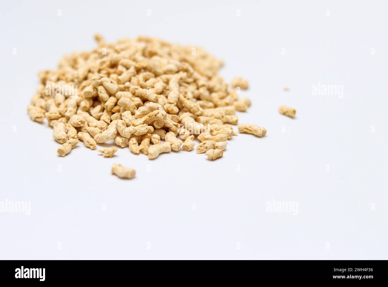 Dried soy bean meat mince pile on white background Stock Photo - Alamy