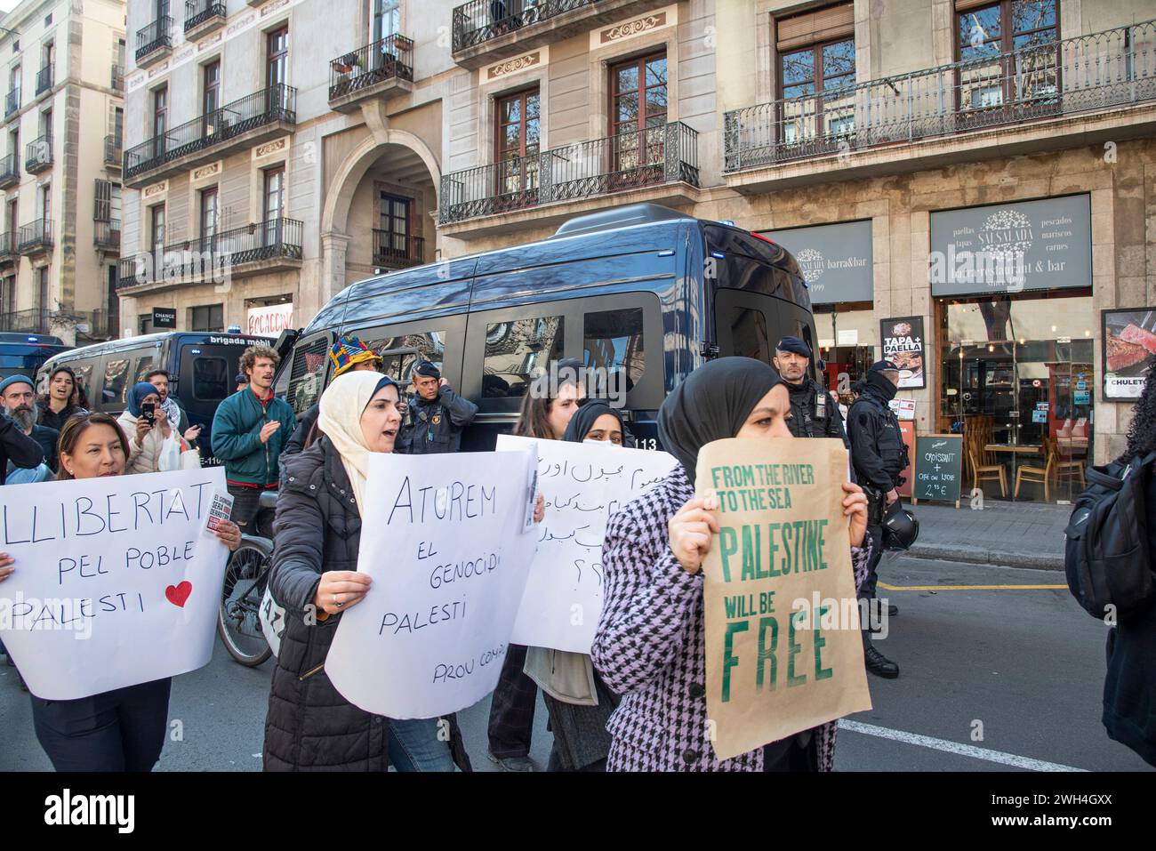 Barcelona, Barcelona, Spain. 7th Feb, 2024. Group of women carrying ...