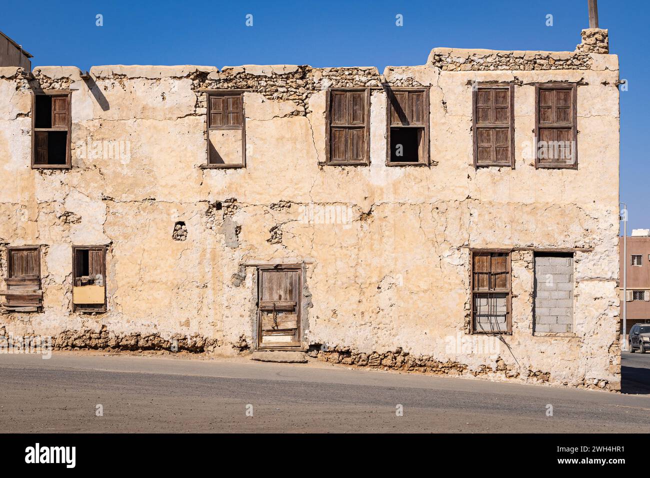 Middle East, Saudi Arabia, Tabuk, Duba. An old stone stucco building in ...