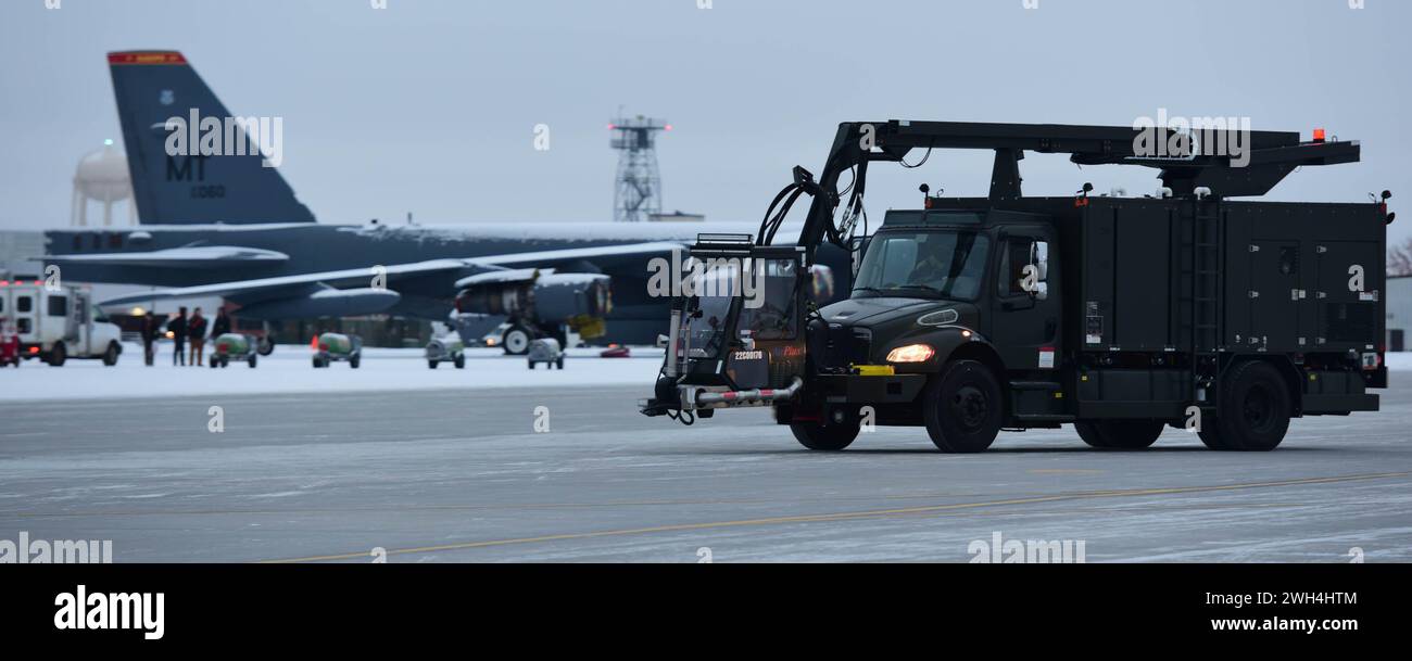 A de-icing truck drives through the flightline during Exercise Prarie ...