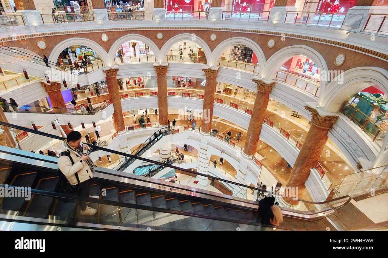 SHANGHAI, CHINA - FEBRUARY 7, 2024 - Tourists shop at the Moon Star Global Harbor Mall, which is ...