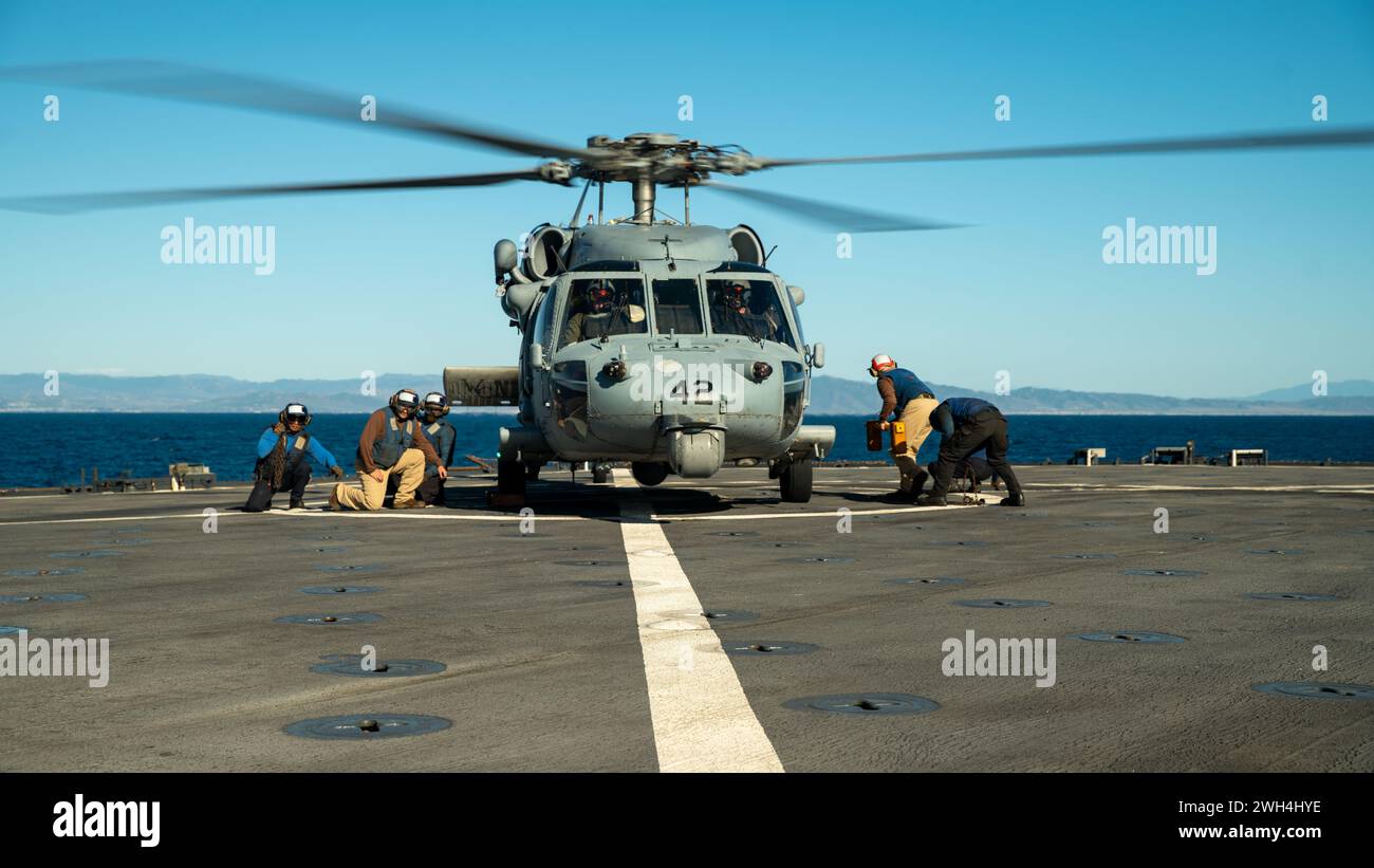 A U.S. Navy MH-60S Sea Hawk assigned to Helicopter Sea Combat Squadron ...