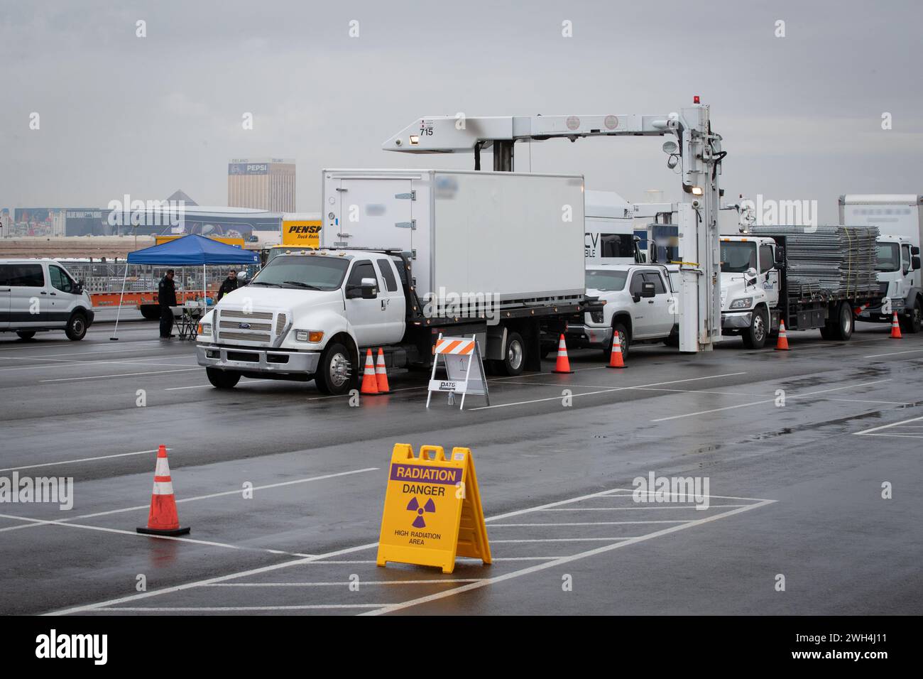 Arriving vehicles delivering equipment, souvenirs and concessions wait ...