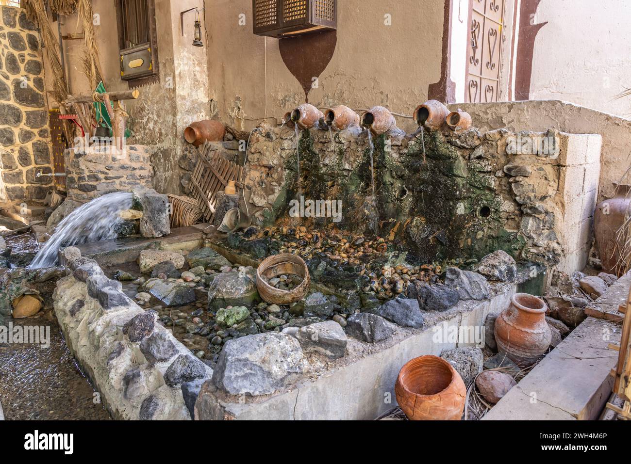 Middle East, Saudi Arabia, Madinah Province, Medina. Water pouring from ...